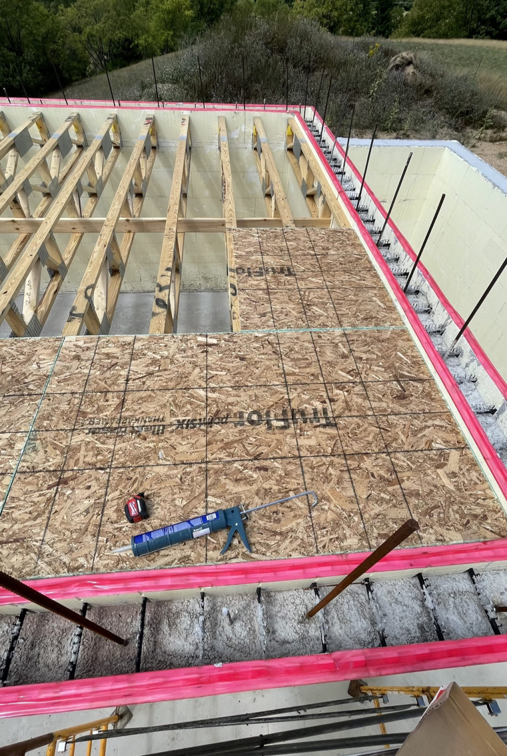 Installing Basement Floor Trusses - Fletcher Creek Cottage
